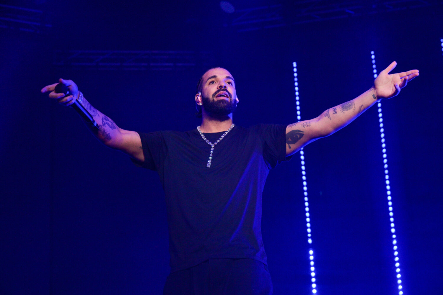Drake's "It's All A Blur" Merch Includes Nike Hats & Graphic Tees